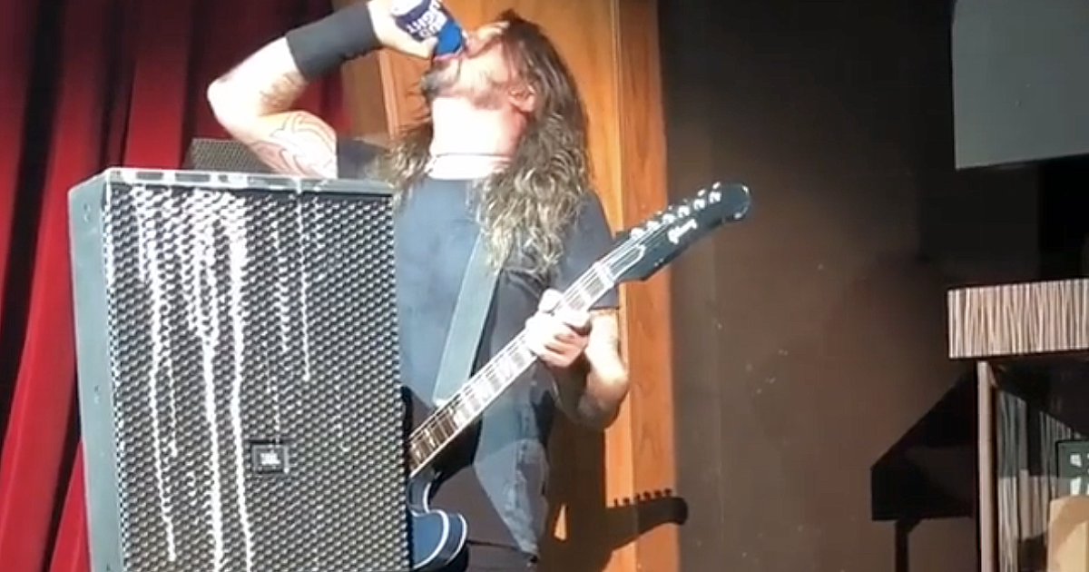 Watch Dave Grohl Fall Off Stage After Chugging A Beer | Kerrang!